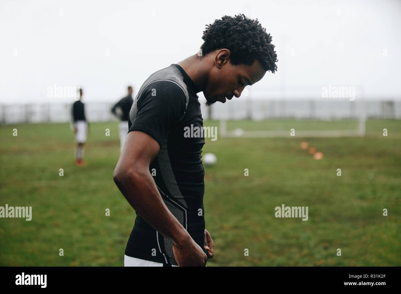 Crouching Football Player Standing