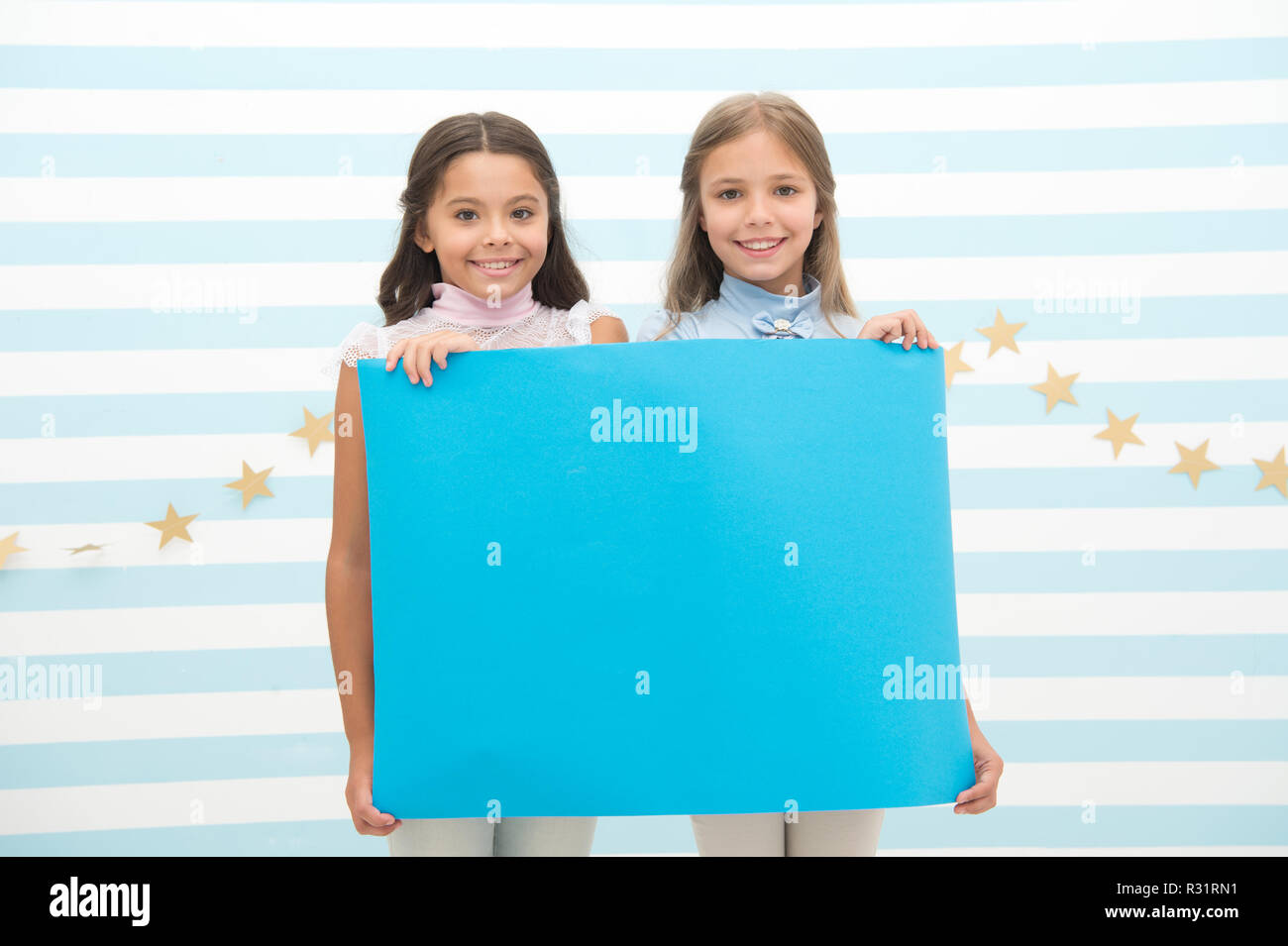 Your advertisement in good hands. Girls kids hold advertisement poster ...