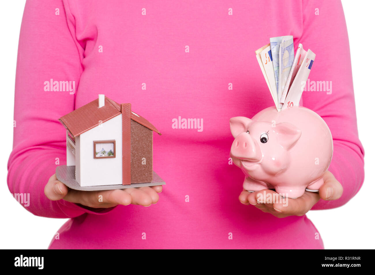 house and piggy bank on a hand Stock Photo - Alamy