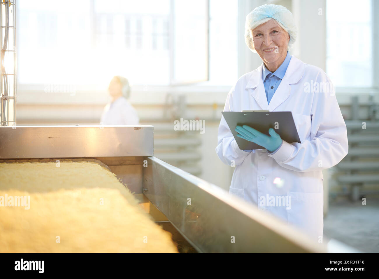 Senior Factory Worker in Sunlight Stock Photo - Alamy