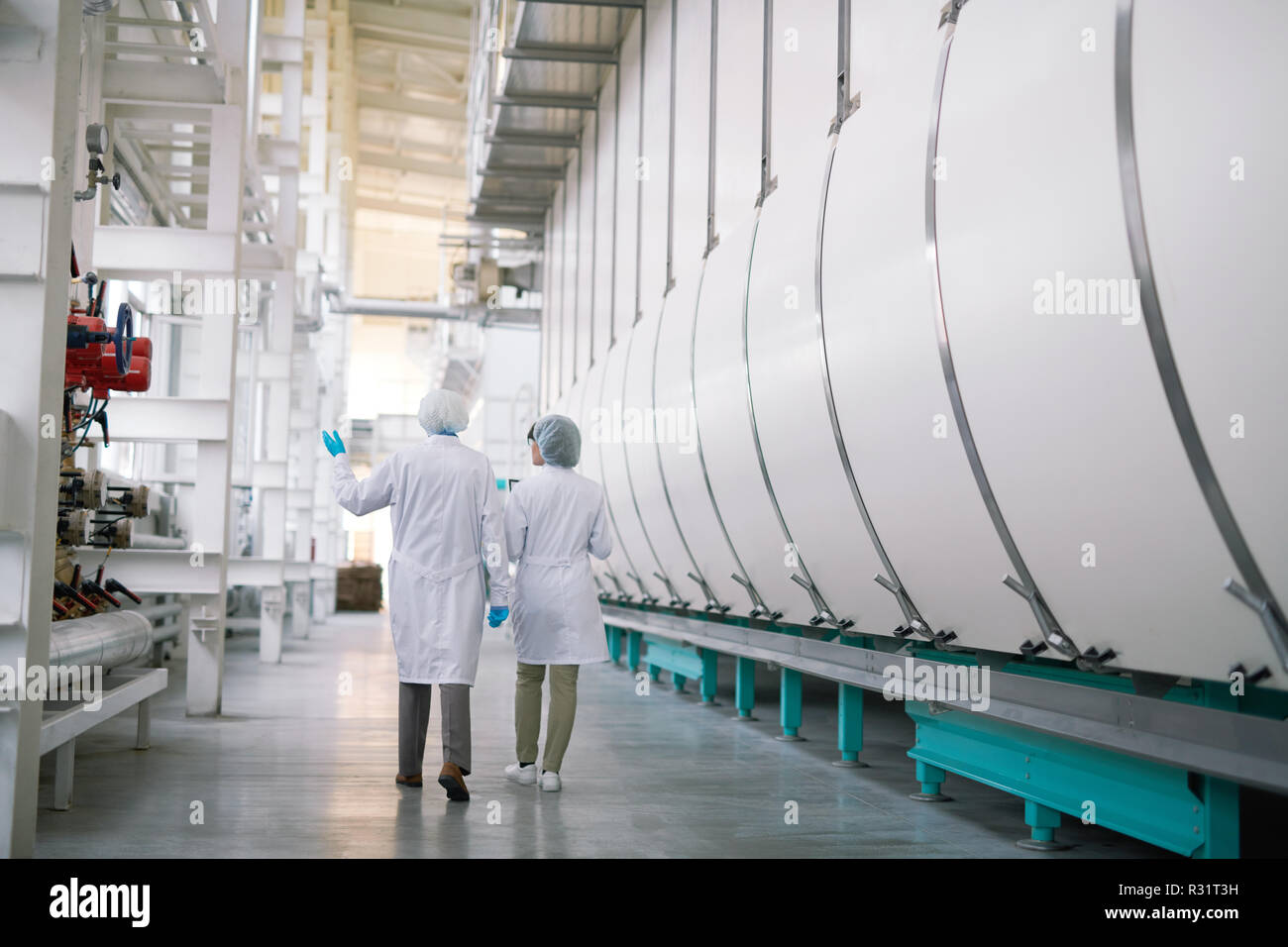 Workers Crossing Clean Workshop Stock Photo - Alamy
