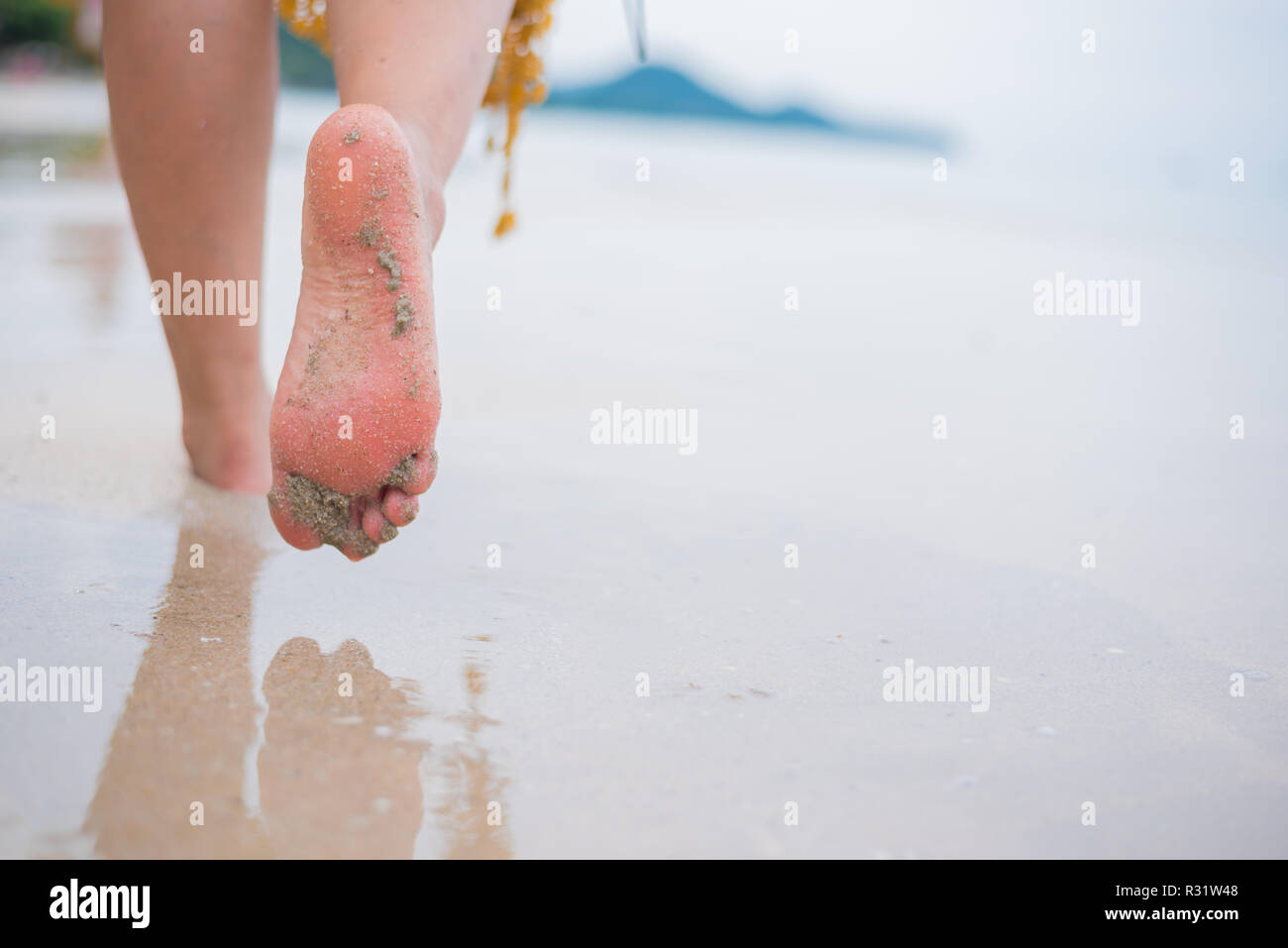 Beautiful women walk alone on the beach on Summer. Sea and sand Stock ...