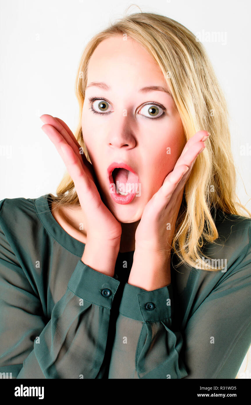 young woman is astonished Stock Photo - Alamy