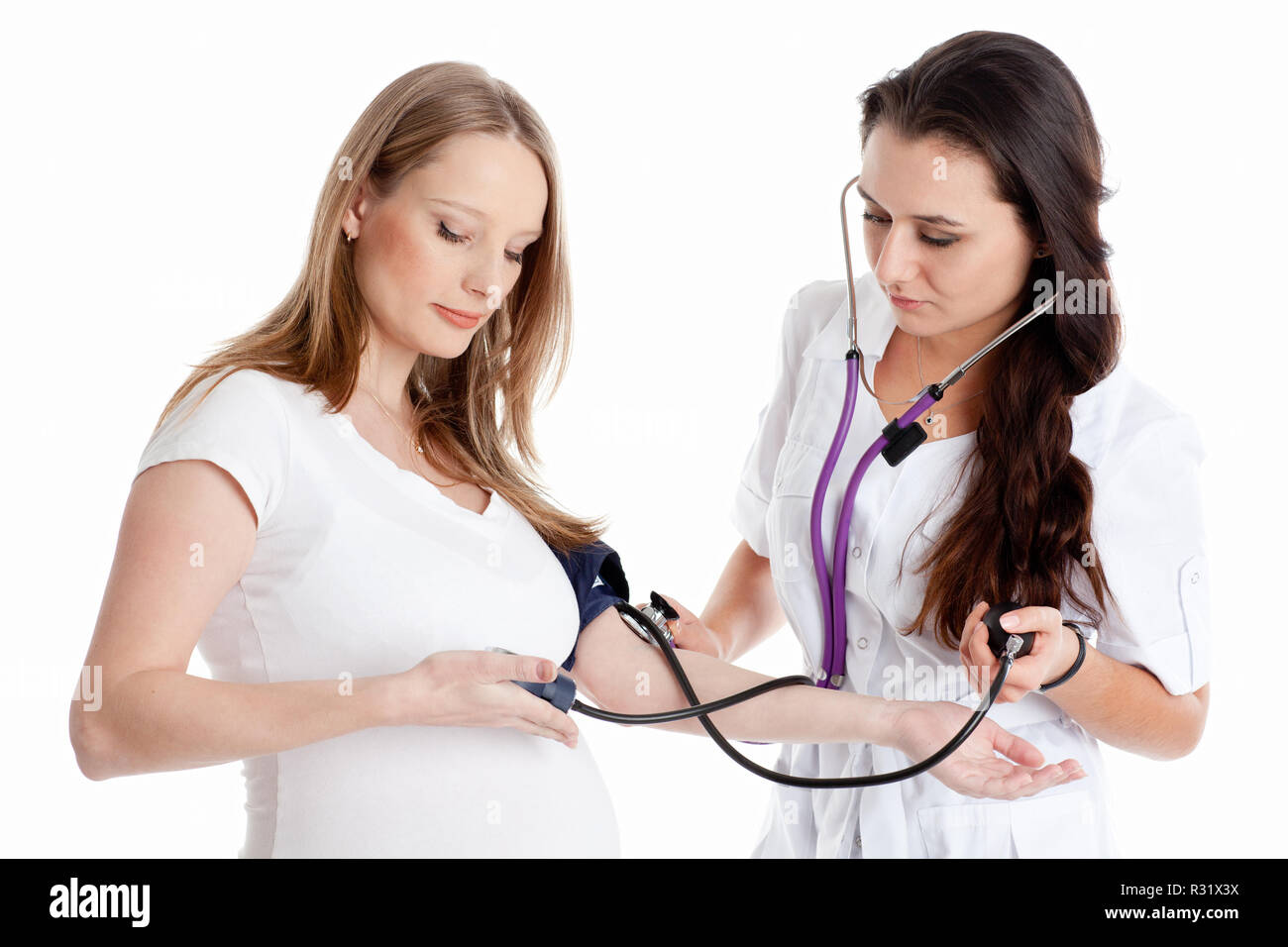 Female doctor measuring pregnant belly Cut Out Stock Images & Pictures ...