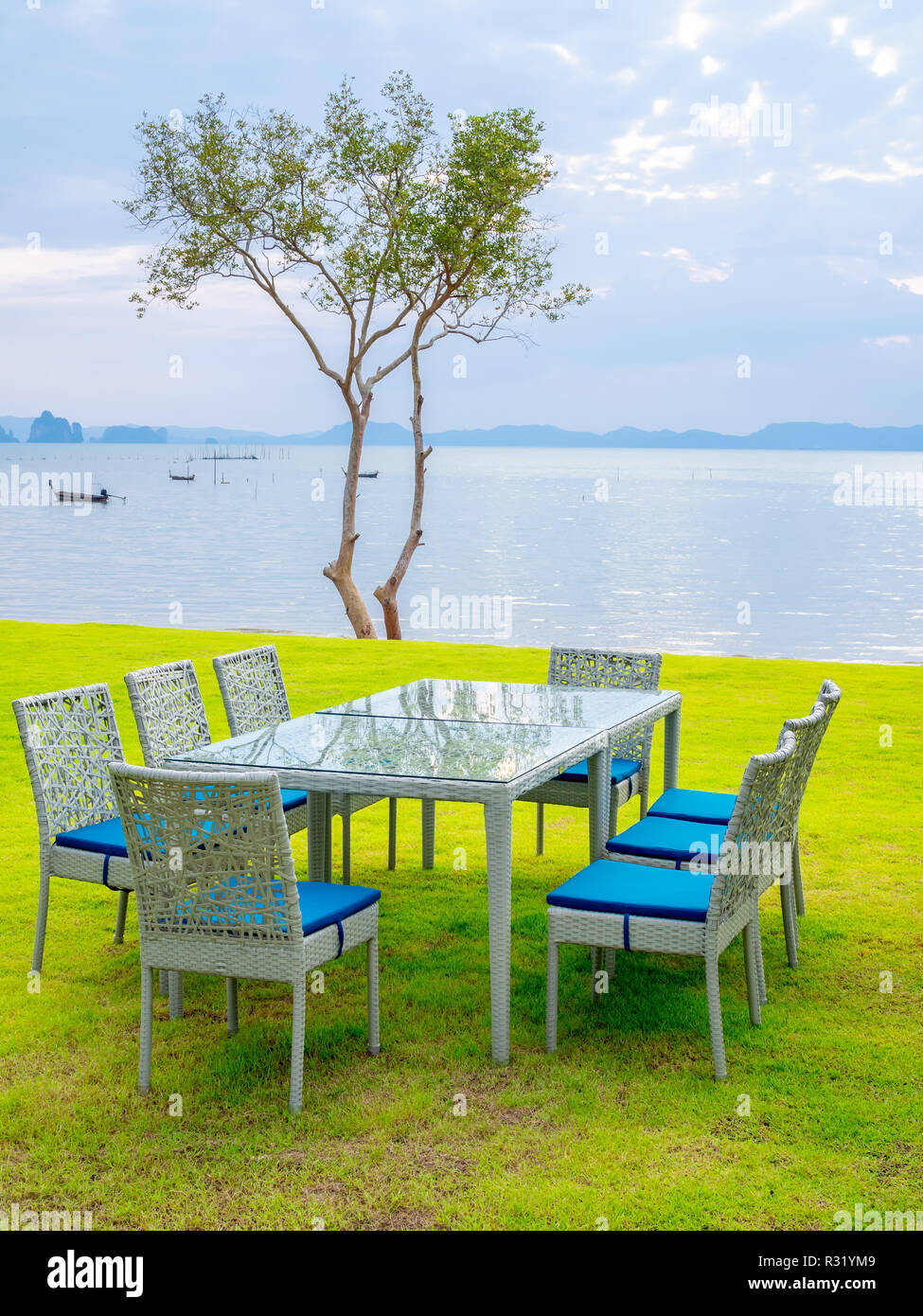Dining table set with Seascape background. Modern table and chairs with ...