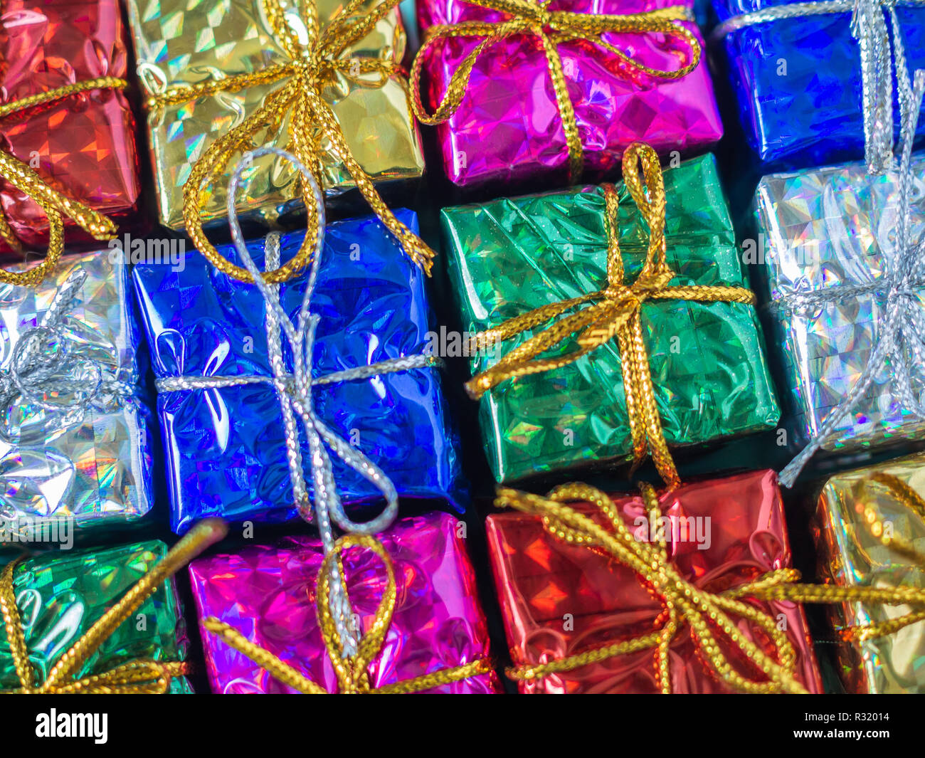 Close-up small colorful gift boxes. Top view of many gifts wrapped ...