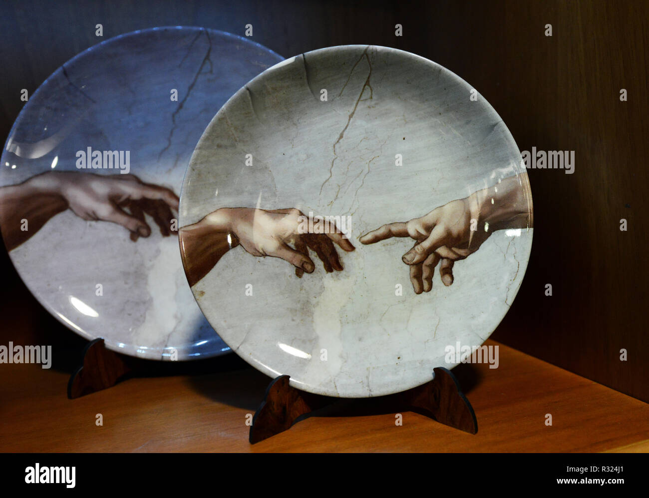 Souvenir ceramic plates decorated with a copy of Michelangelo's Sistine ...