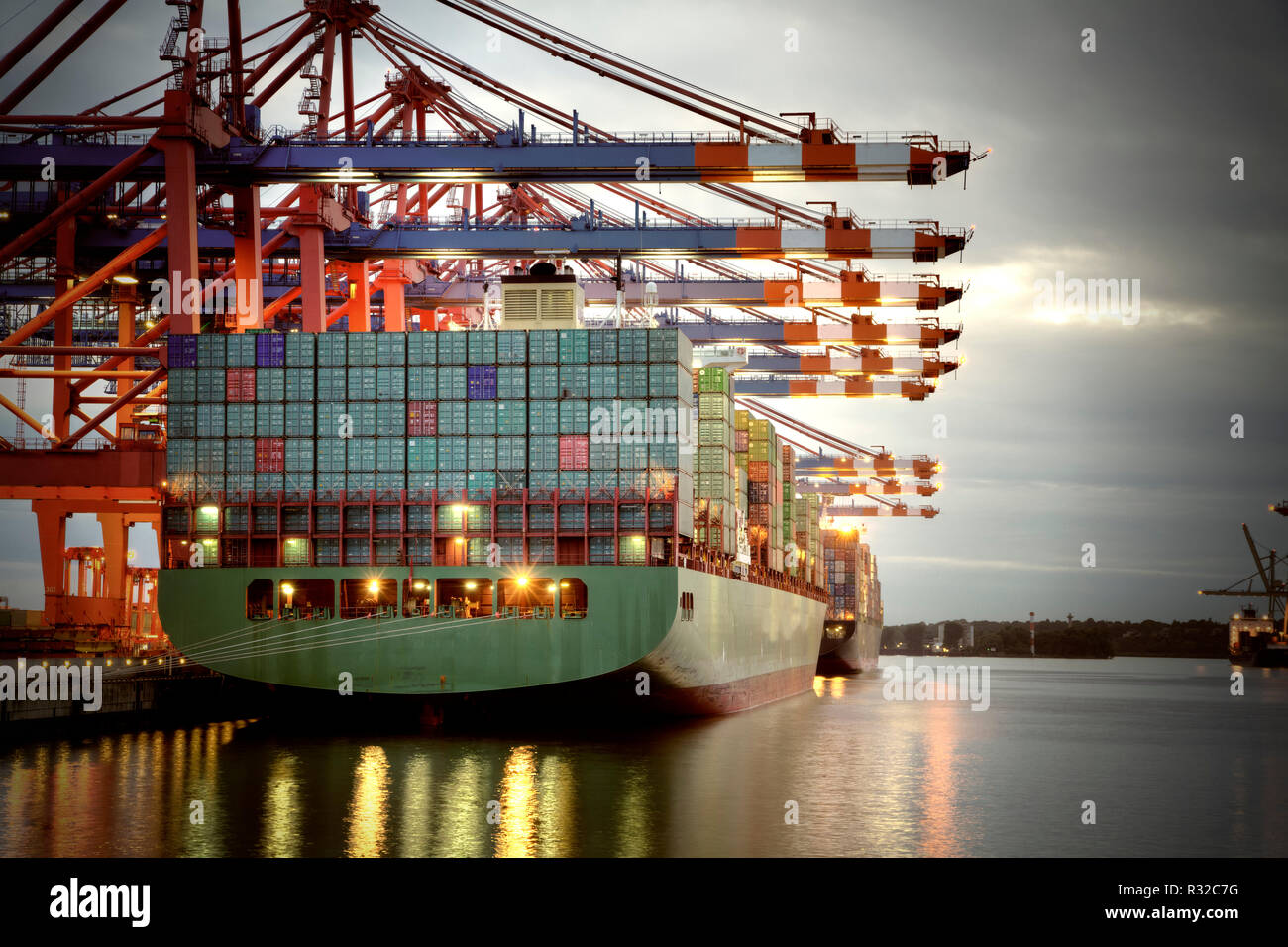 Cargo ship sailing colored containers hi-res stock photography and ...
