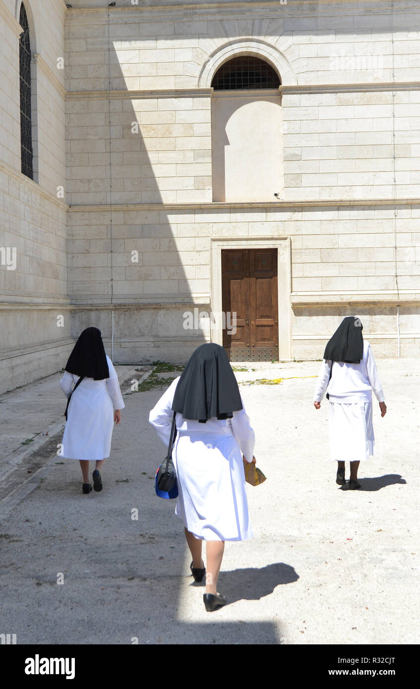 Catholic nuns walk by the Basilica of Saint Paul outside the walls in ...