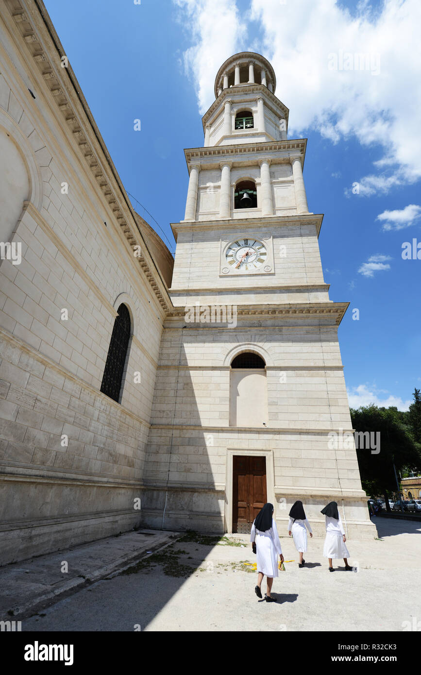 Catholic nuns walk by the Basilica of Saint Paul outside the walls in ...