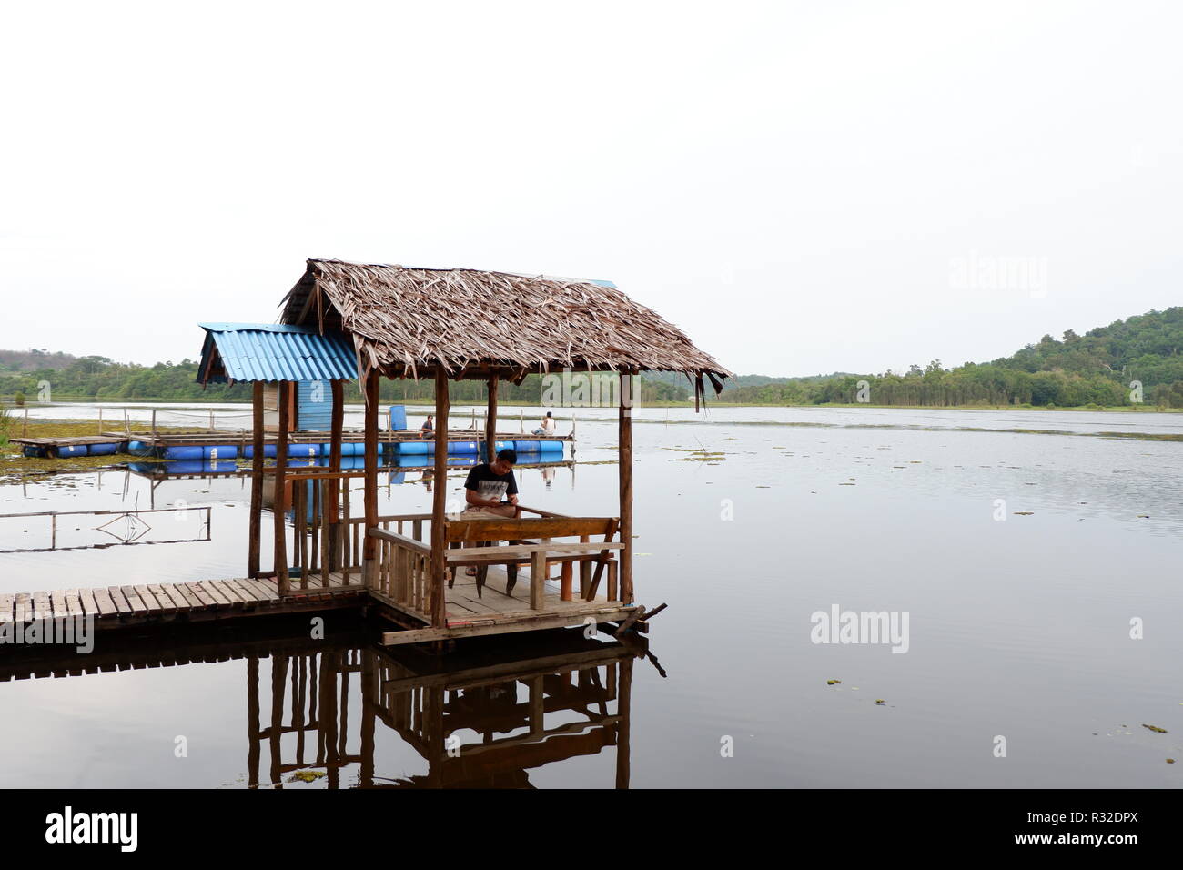 small wooden fishing hut on the lake Stock Photo - Alamy
