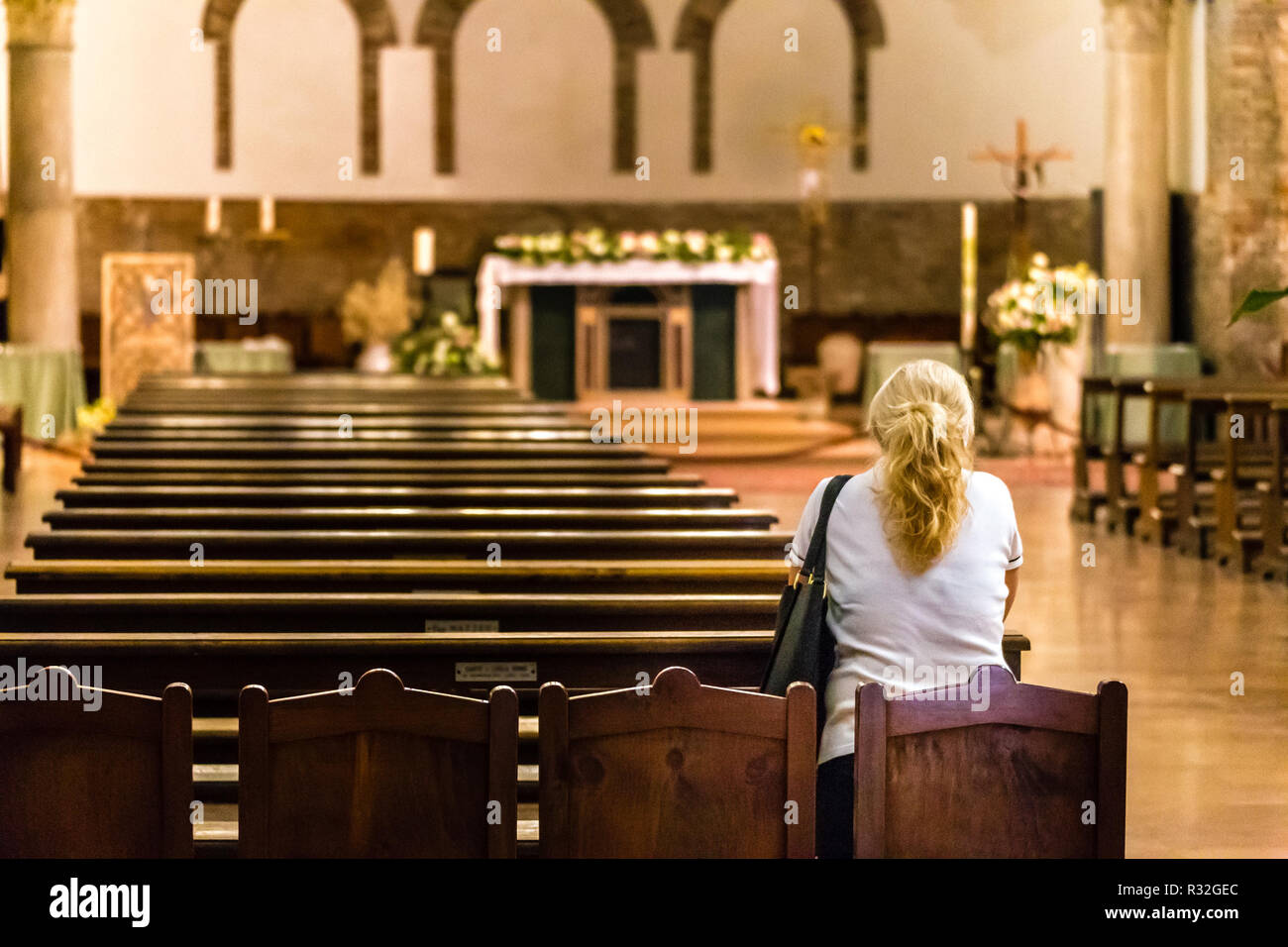 Woman praying in catholic church hi-res stock photography and images ...