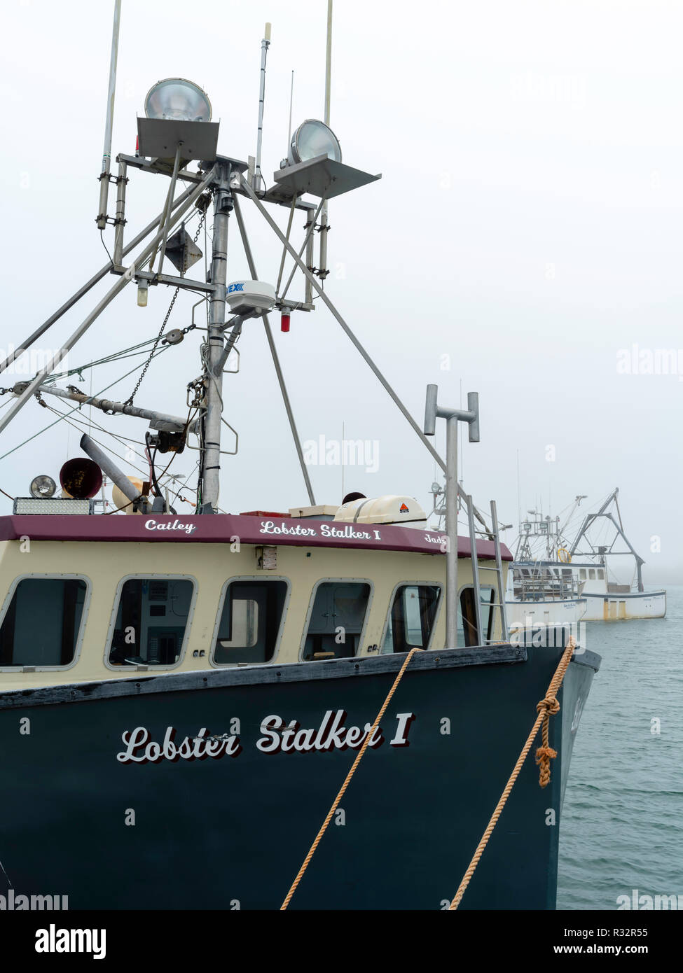 Lobster boats sit in a protected cove at Cape Forchu, Nova Scotia ...