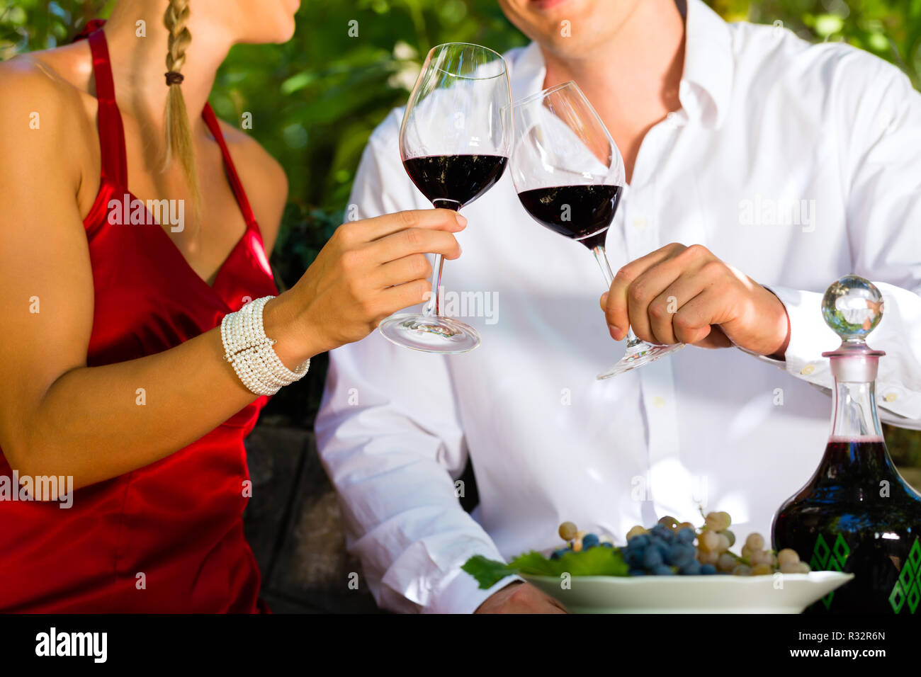 woman and man toasting with wine Stock Photo - Alamy