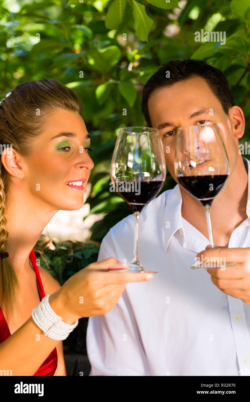 woman and man toasting with wine Stock Photo - Alamy