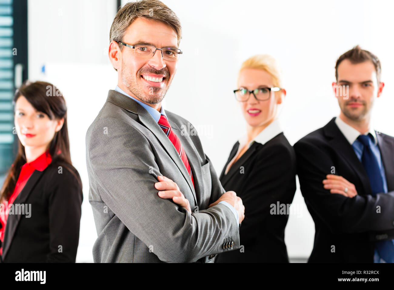 business - a group of businessmen in an office Stock Photo - Alamy
