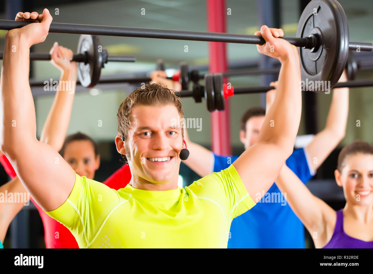 group with dumbbell workout in gym Stock Photo - Alamy