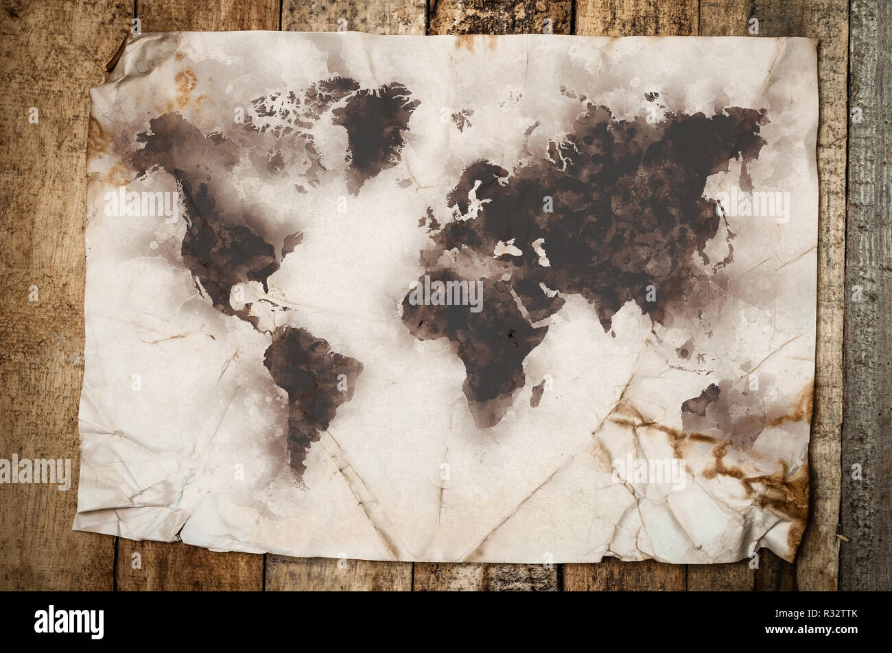 World map on Vintage Crumpled paper texture on wooden table Stock Photo ...