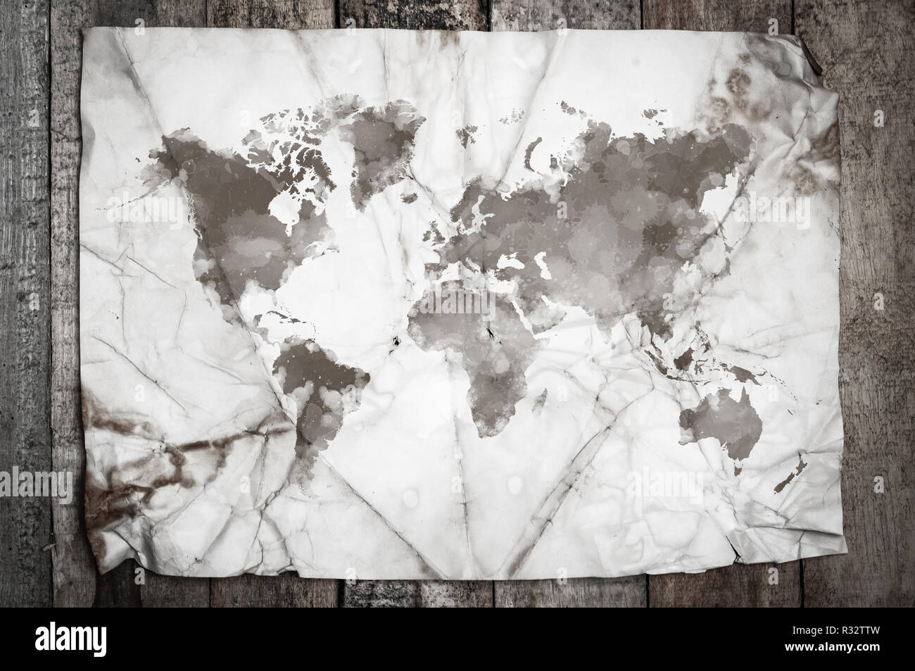 World map on Vintage Crumpled paper texture on wooden table Stock Photo ...