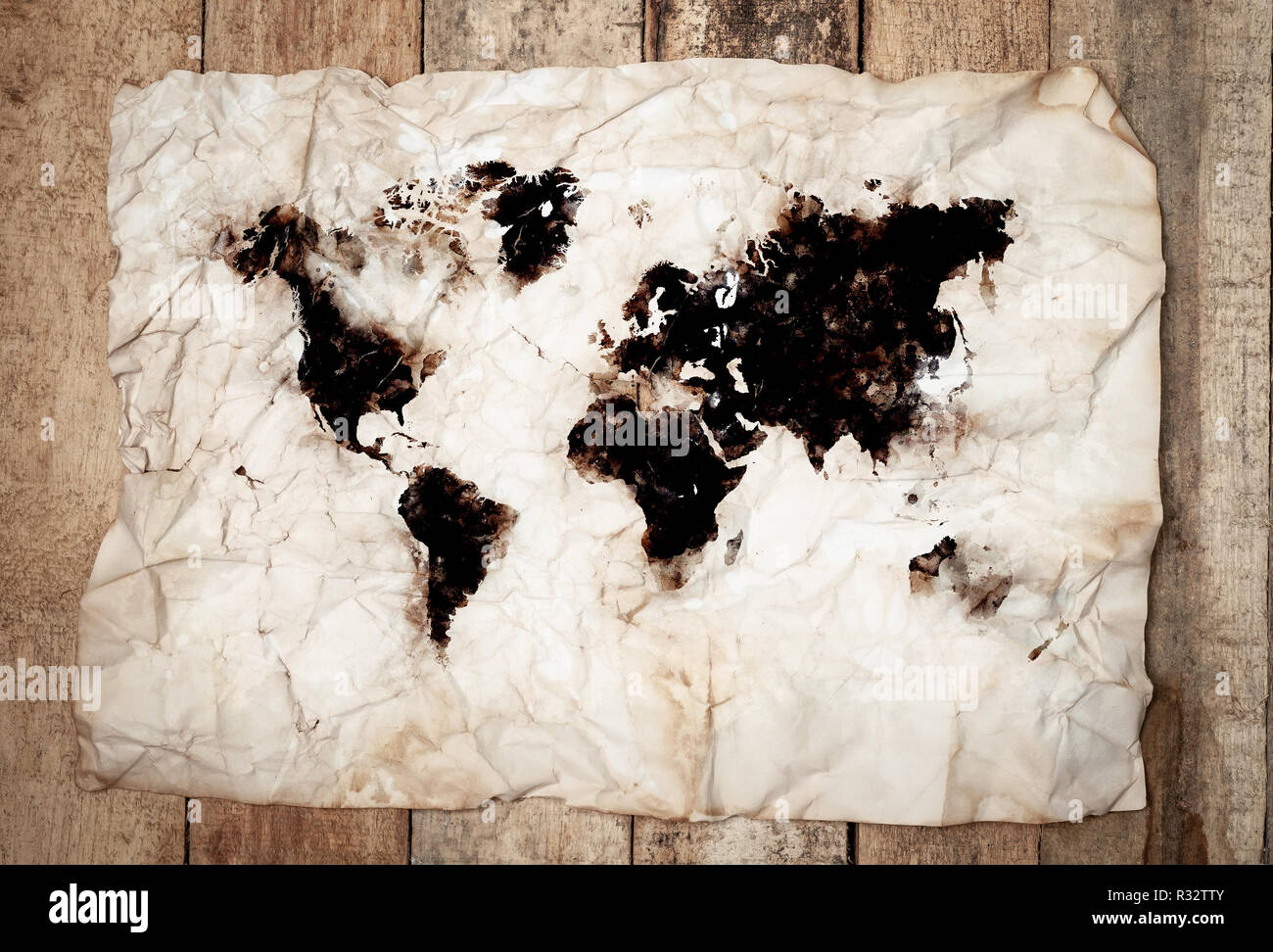 World map on Vintage Crumpled paper texture on wooden table Stock Photo ...