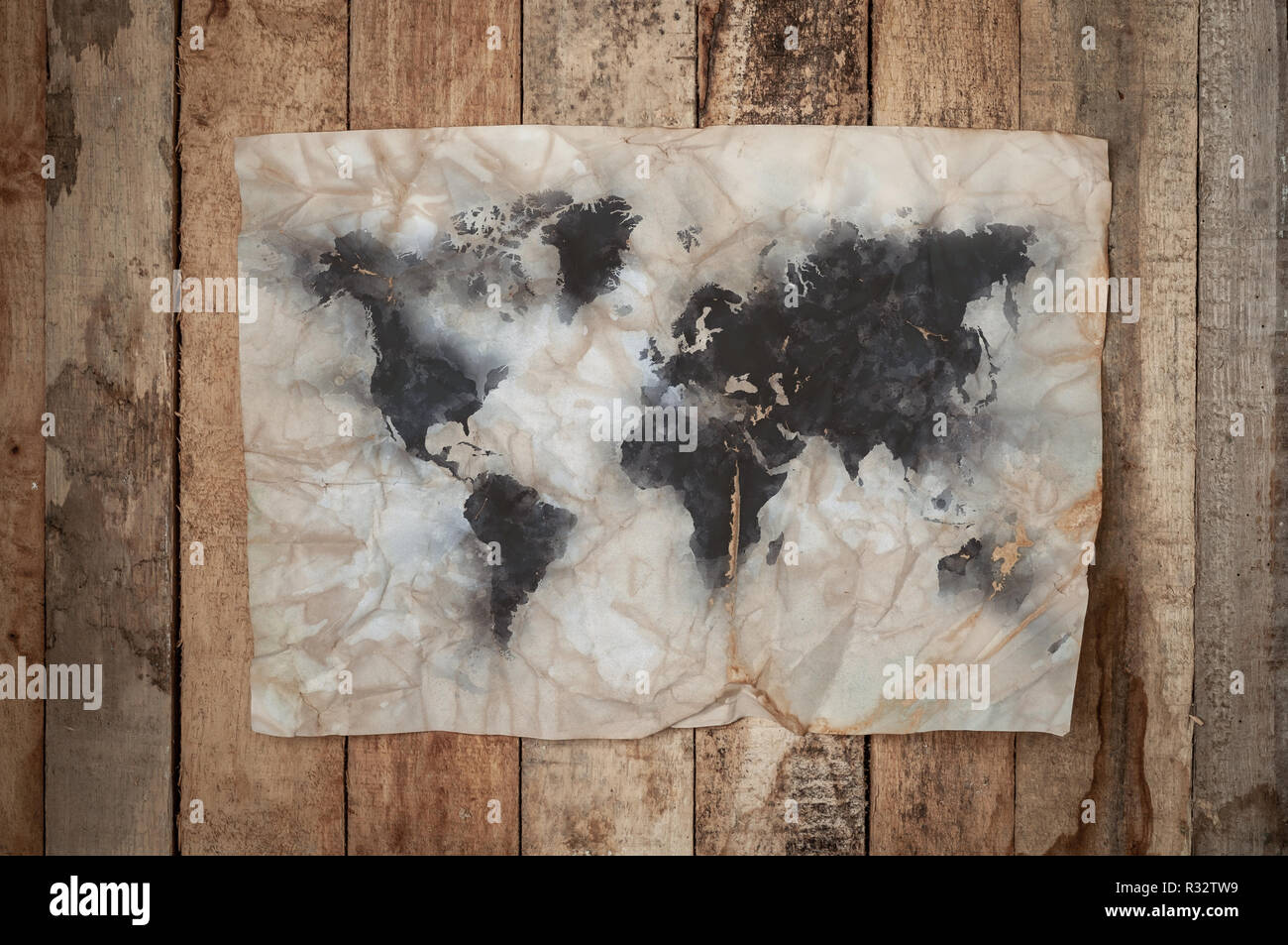 World map on Vintage Crumpled paper texture on wooden table Stock Photo ...