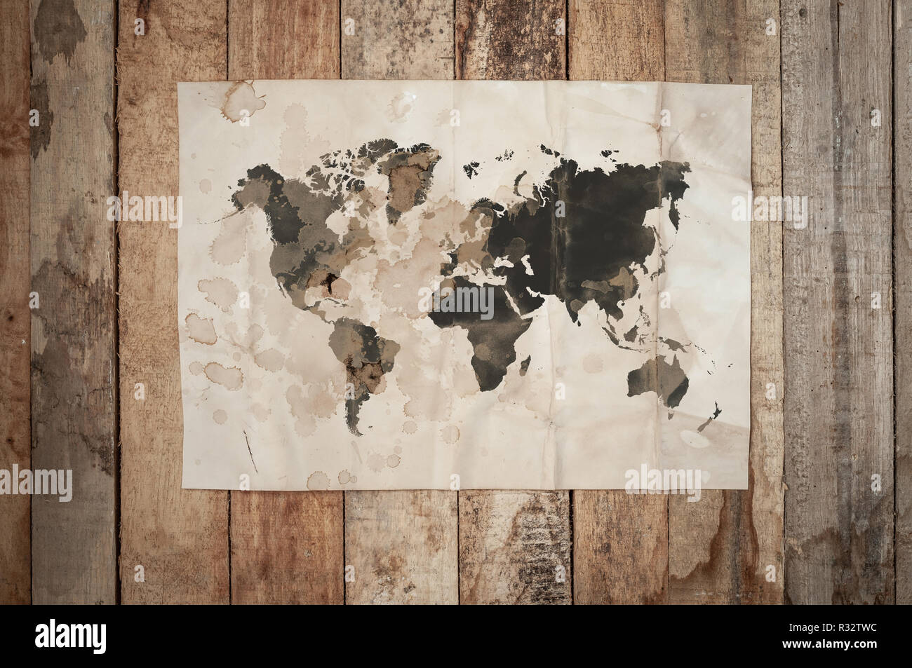 World map on Vintage Crumpled paper texture on wooden table Stock Photo ...