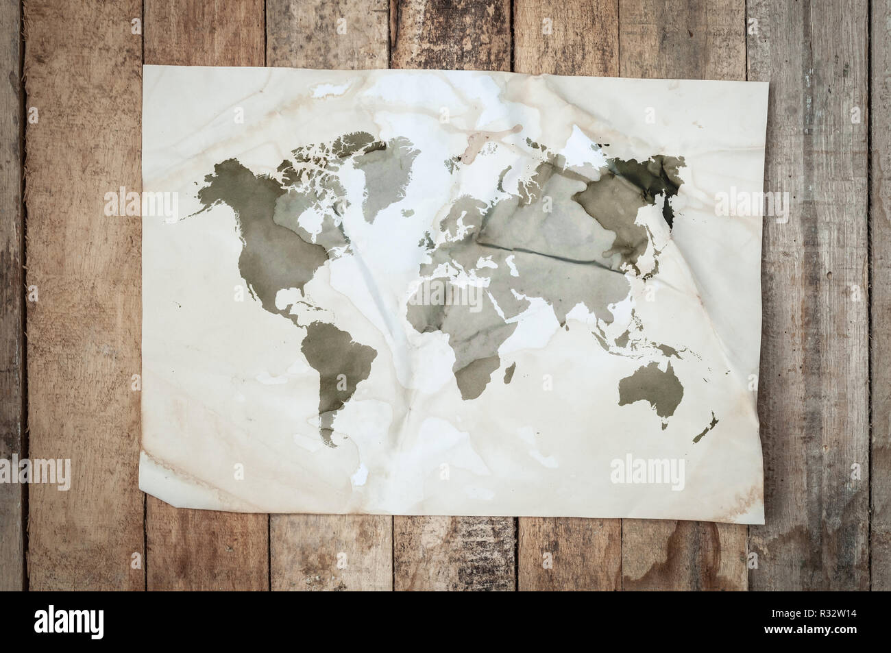 World map on Vintage Crumpled paper texture on wooden table Stock Photo ...