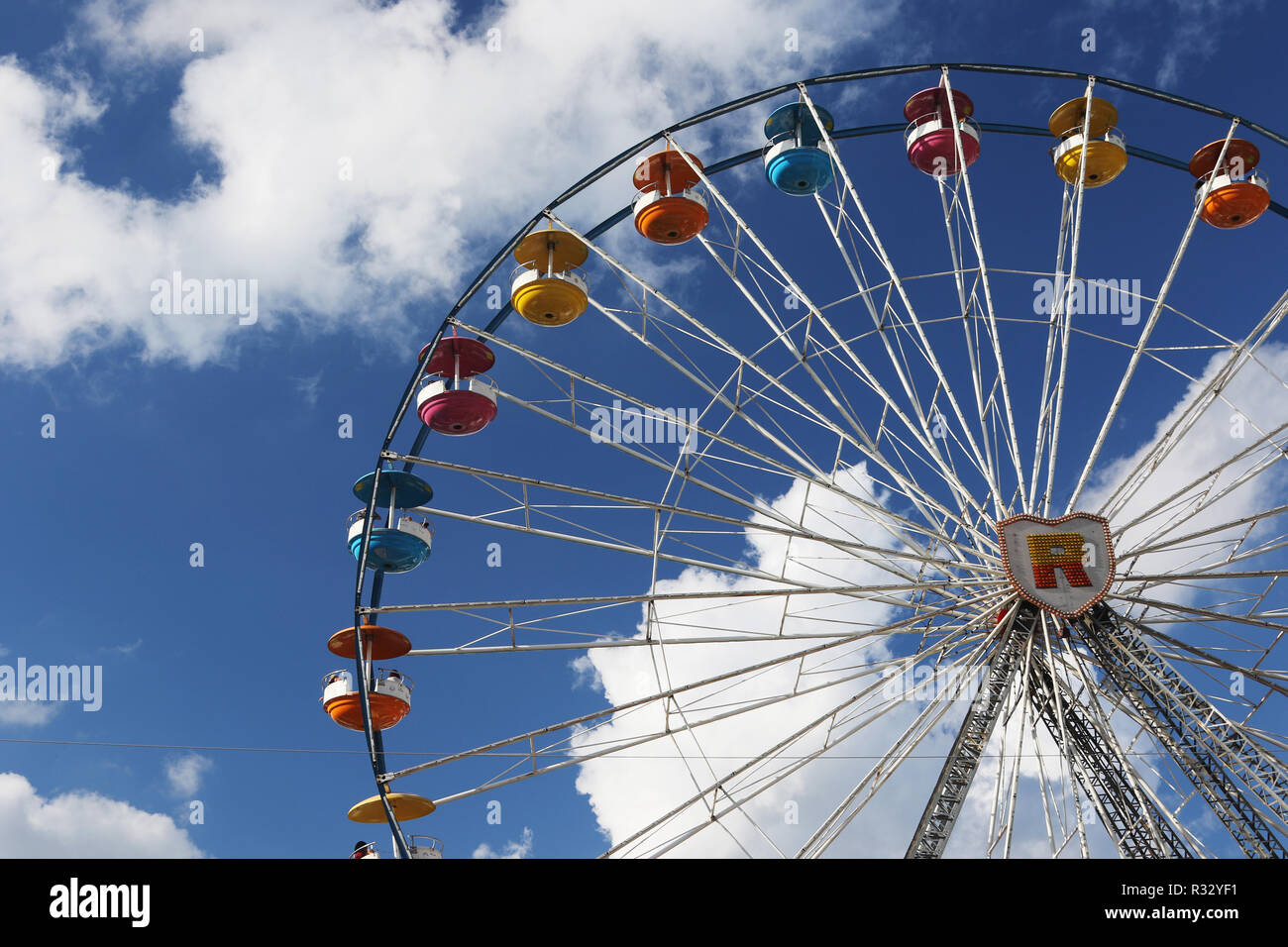 Ferris Wheel carnival ride against blue sky and puffy clouds. Canfield ...