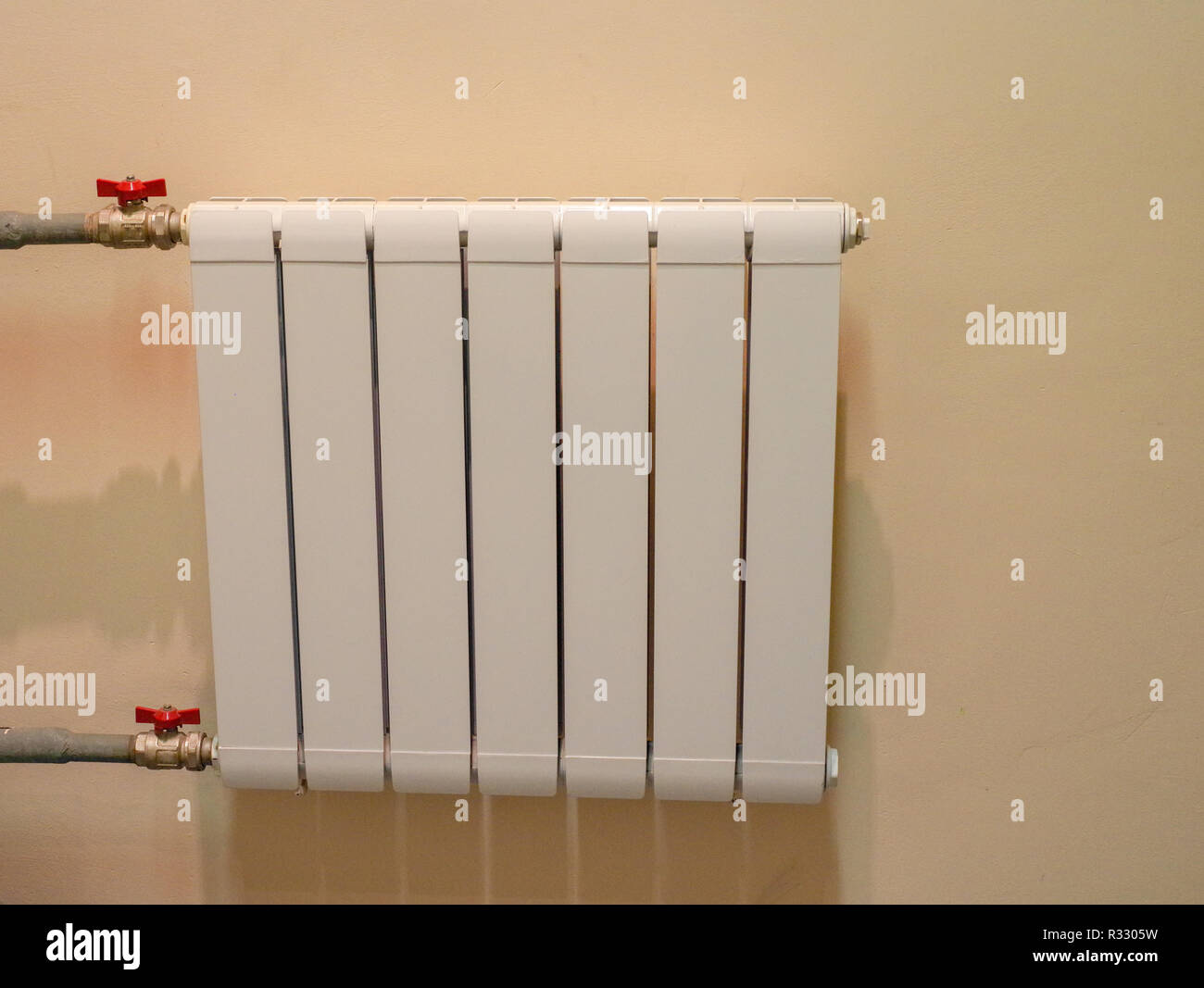 Installing aluminum radiator Stock Photo - Alamy