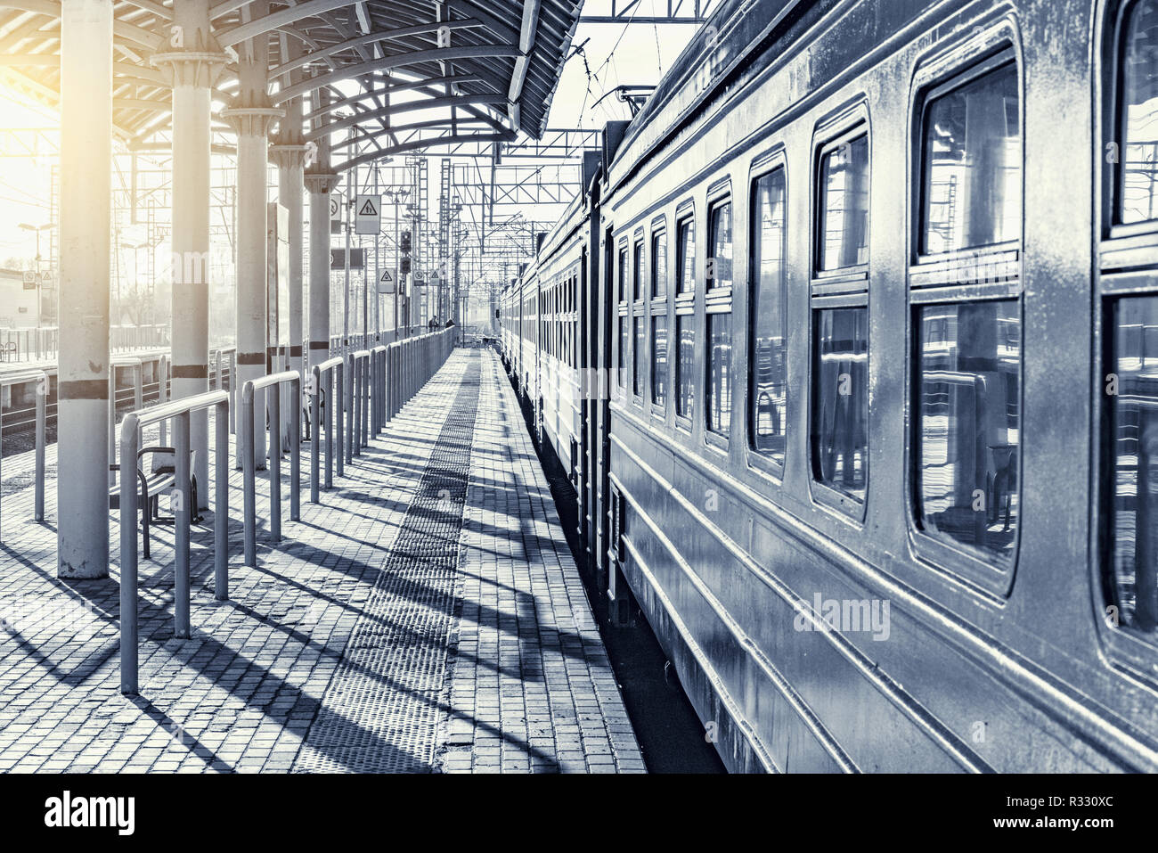 Passenger train stands by the station plaform Stock Photo - Alamy