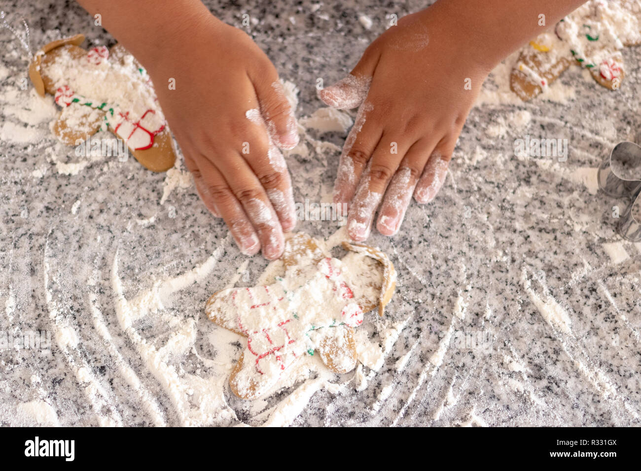 Making gingerbread men over wheat flour Stock Photo - Alamy