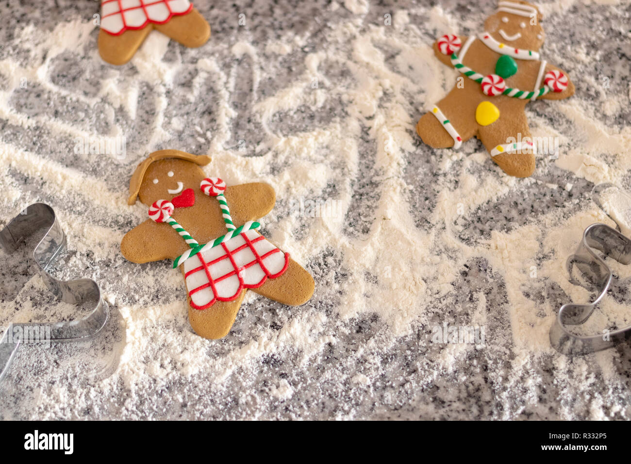 Making gingerbread men over wheat flour Stock Photo - Alamy