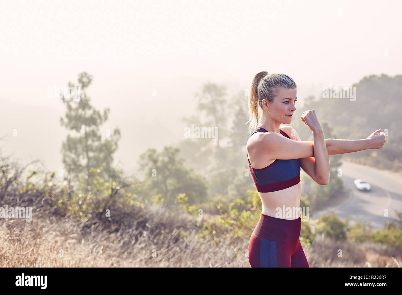Woman stretching before workout sports hi-res stock photography and ...