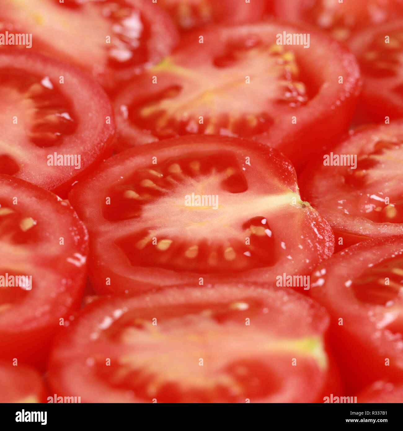 background from half tomatoes Stock Photo - Alamy