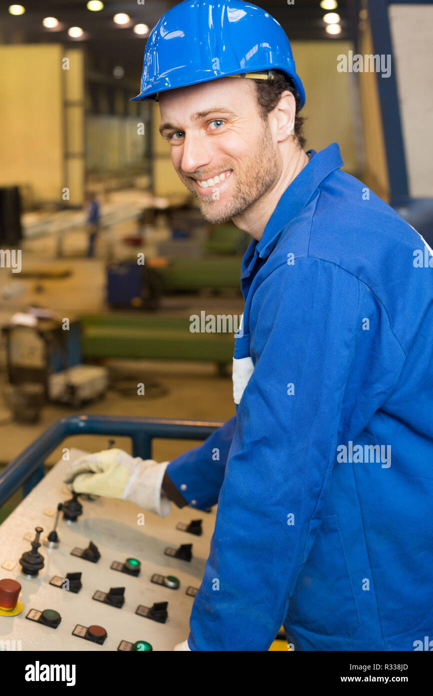 construction worker uses a machine Stock Photo - Alamy