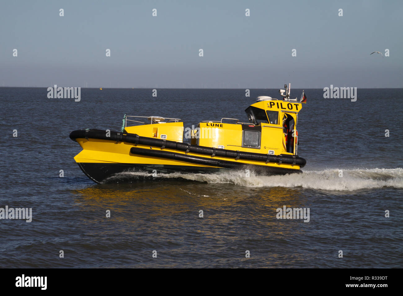 yellow pilot boat on the north sea Stock Photo - Alamy