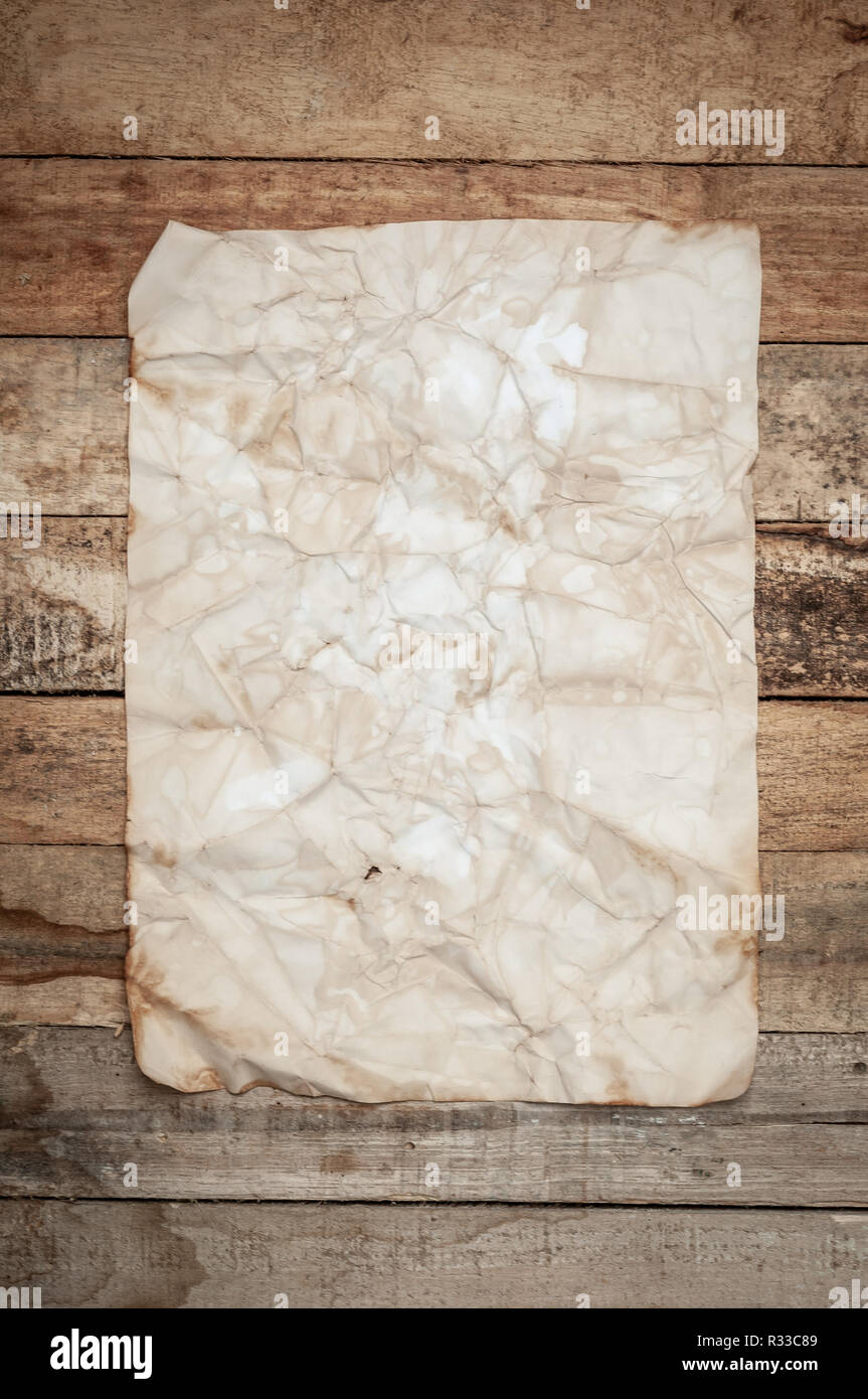Vintage Crumpled paper texture on wooden table Stock Photo - Alamy