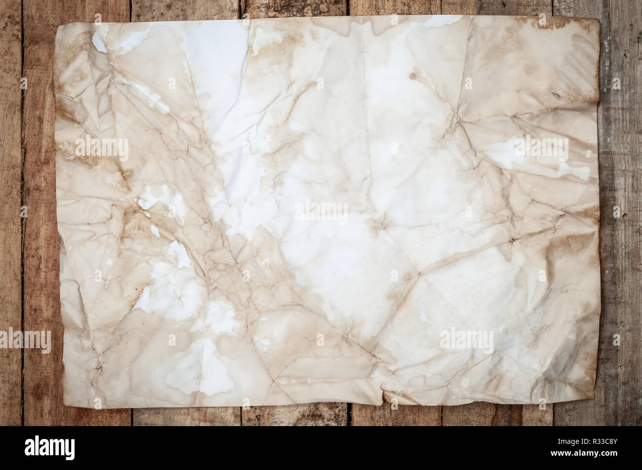 Vintage Crumpled paper texture on wooden table Stock Photo - Alamy