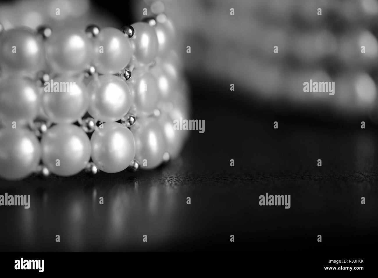 White Pearl Necklace On A Dark Background Close Up Black And White