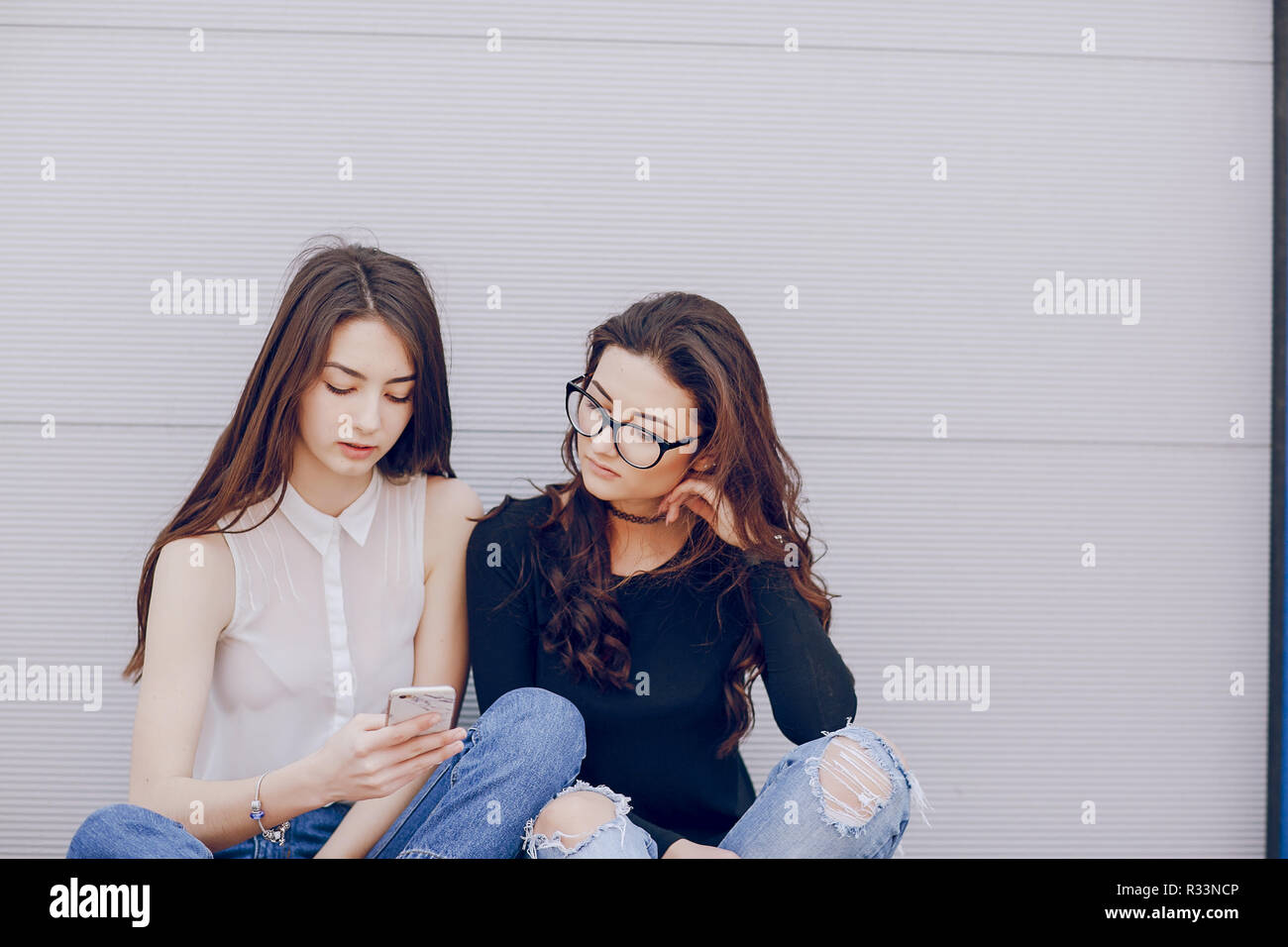 stylish young model walk in the street and pose for a photo on a Sunny ...