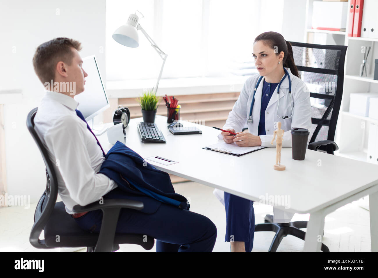 The young man came to see the doctor Stock Photo - Alamy