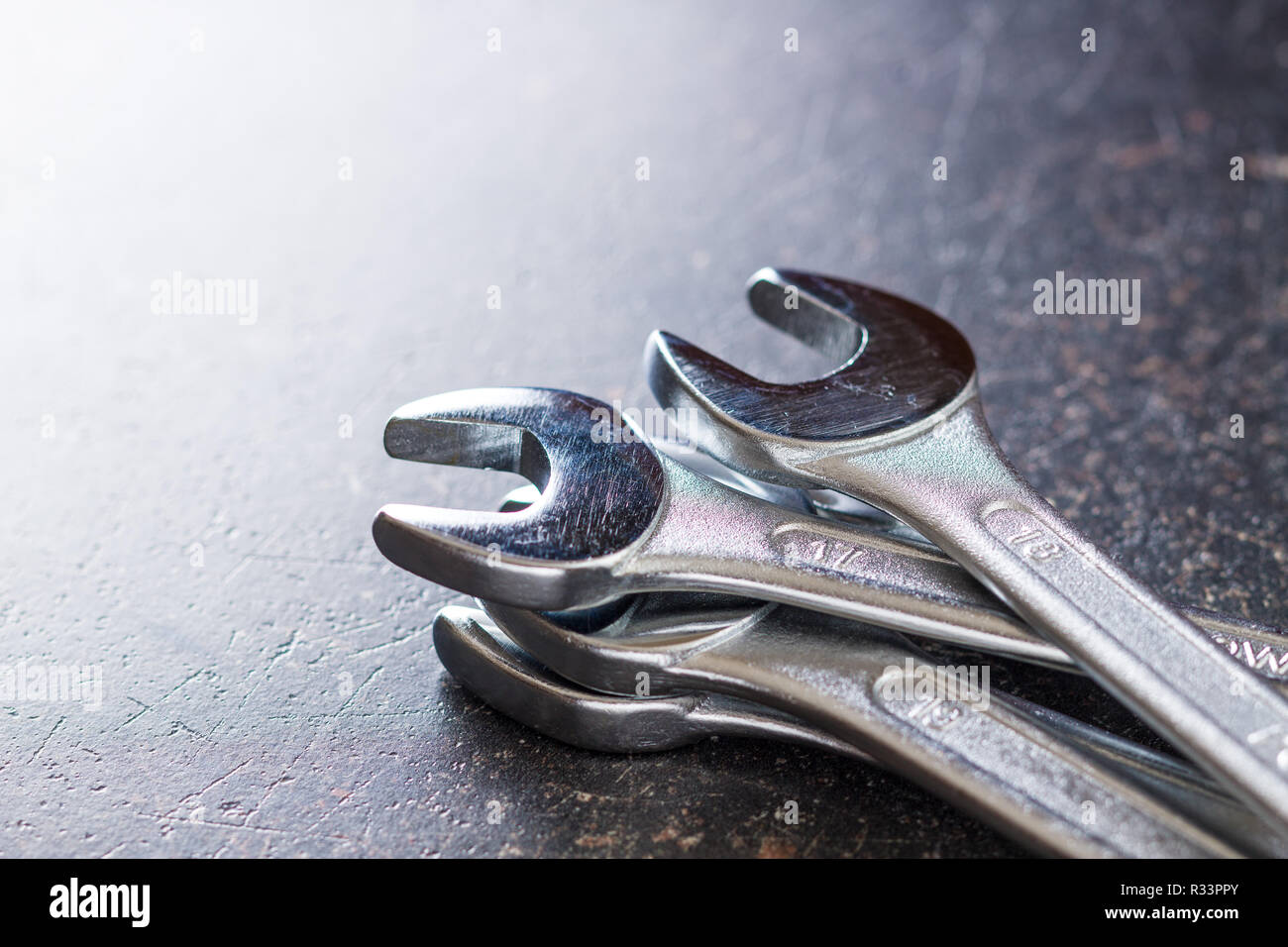 Chrome vanadium wrench. Industrial spanner on old table Stock Photo - Alamy