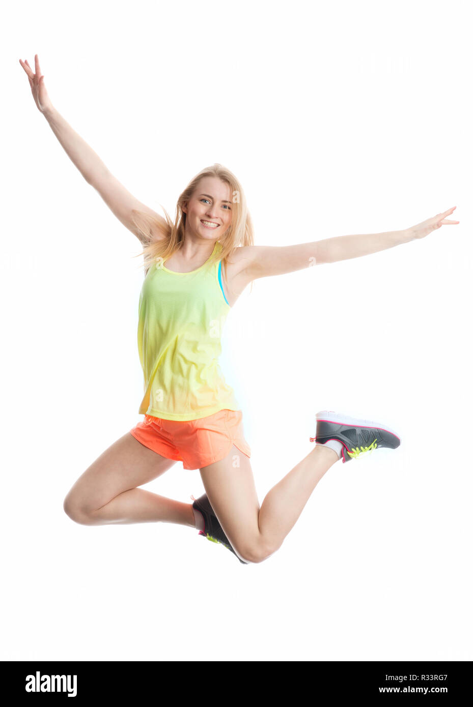 blonde athlete makes a joy jump Stock Photo - Alamy