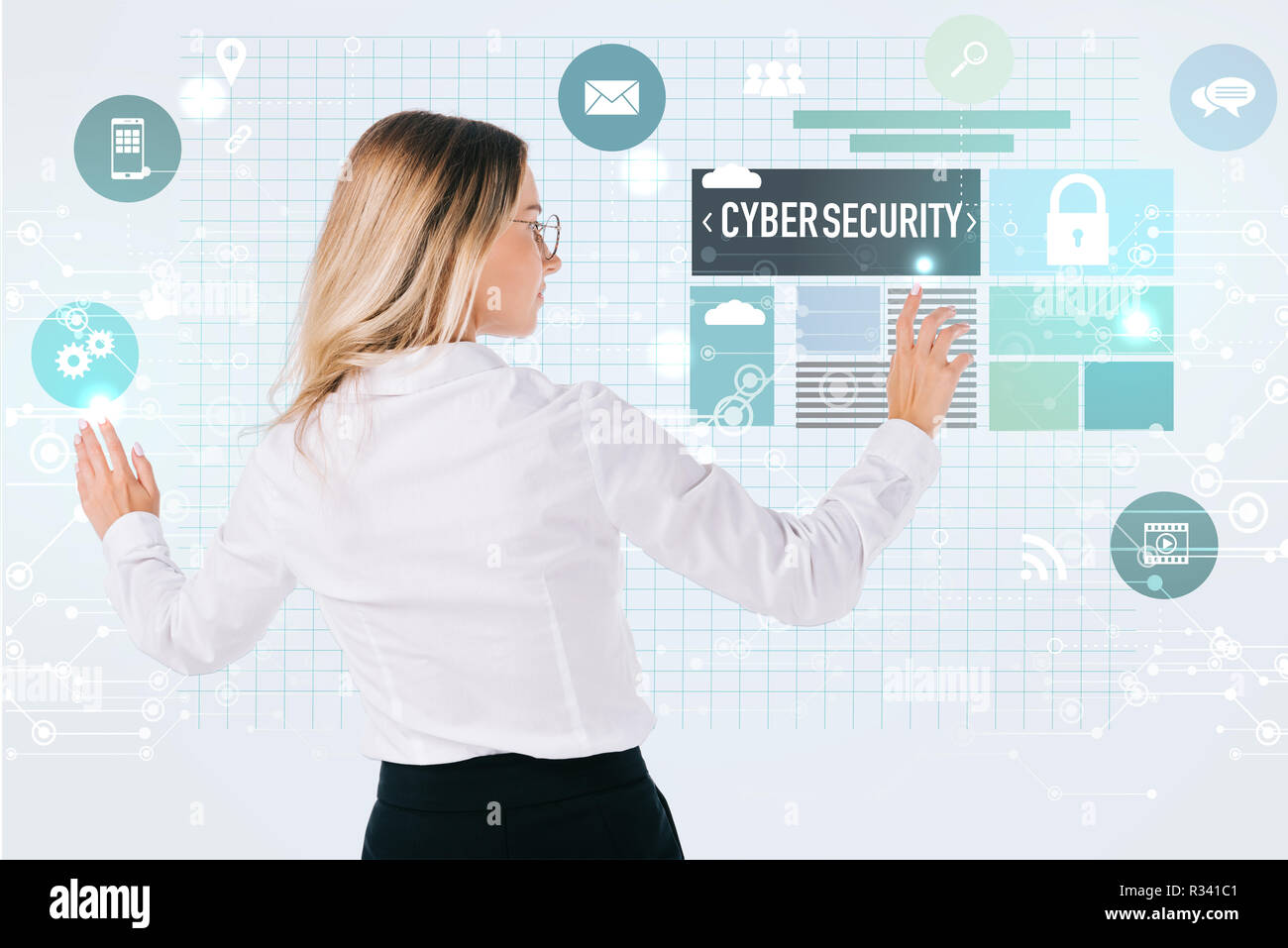 back view of businesswoman in eyeglasses pointing at cyber security ...