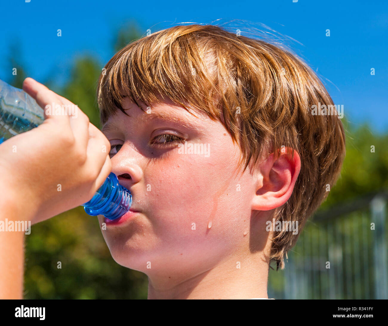 Child sweating drink water hi-res stock photography and images - Alamy