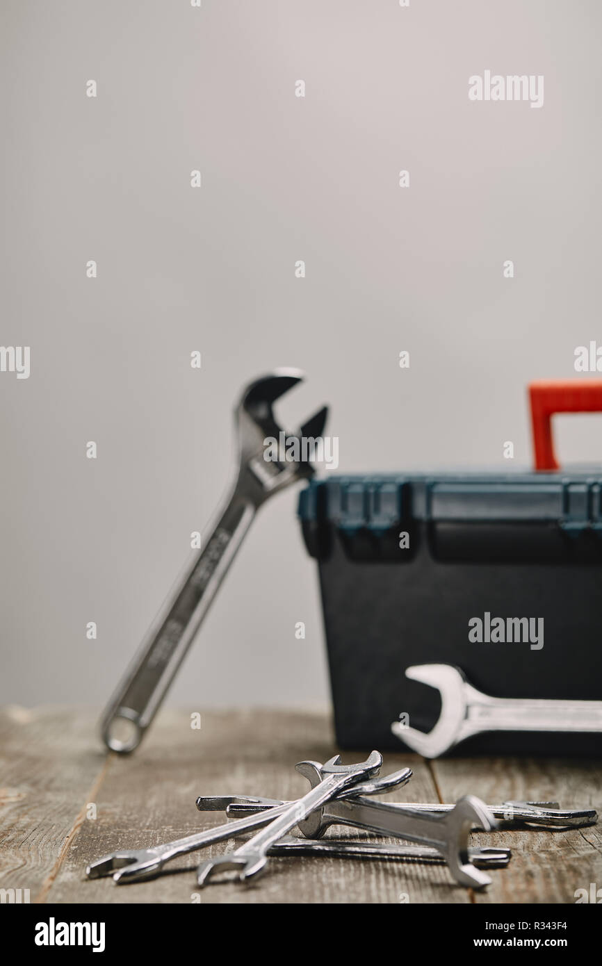 Close up of various tools on wooden table on grey background Stock ...