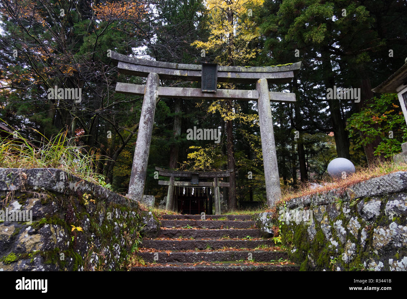 The wood Japanese gate leading into the Tobiishi Hachiman Shrine in ...