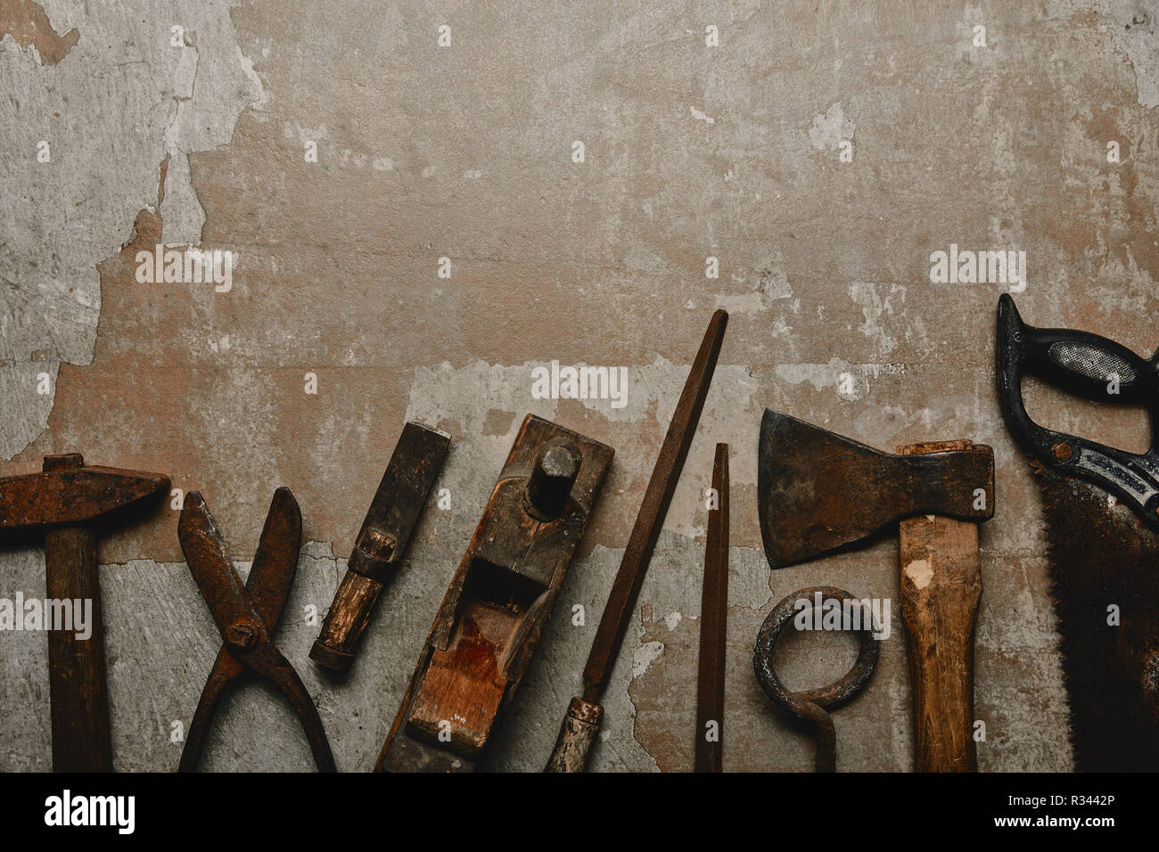 Top view of different carpentry tools on old background Stock Photo - Alamy