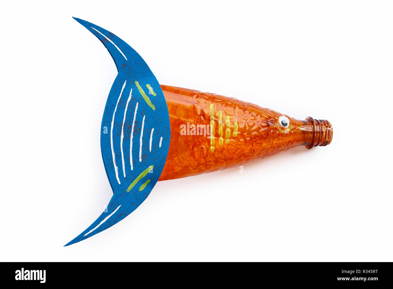 Plastic bottle recycled in a fish figure. Reuse garbage. Isolated Stock ...