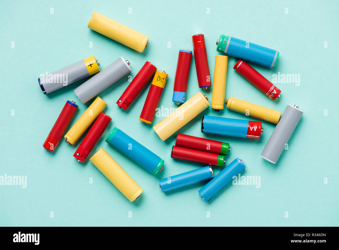 Colorful batteries on blue background hi-res stock photography and ...